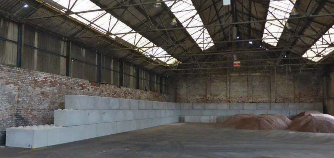 Concrete retaining wall for derelict warehouse | Images