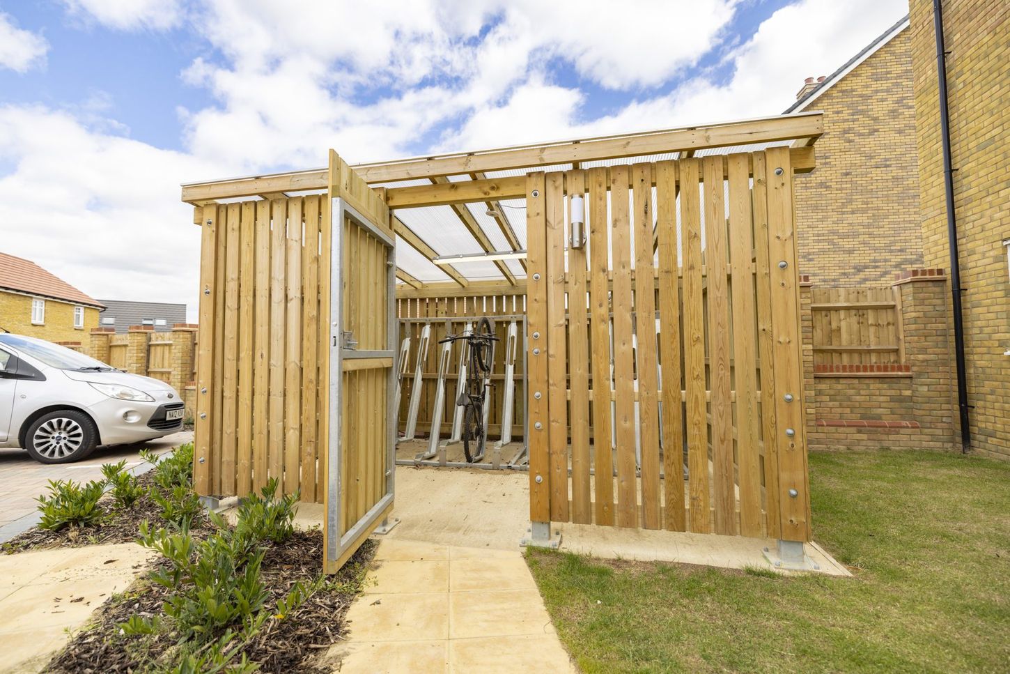 Timber cycle compound with bike racks for new housing development ...