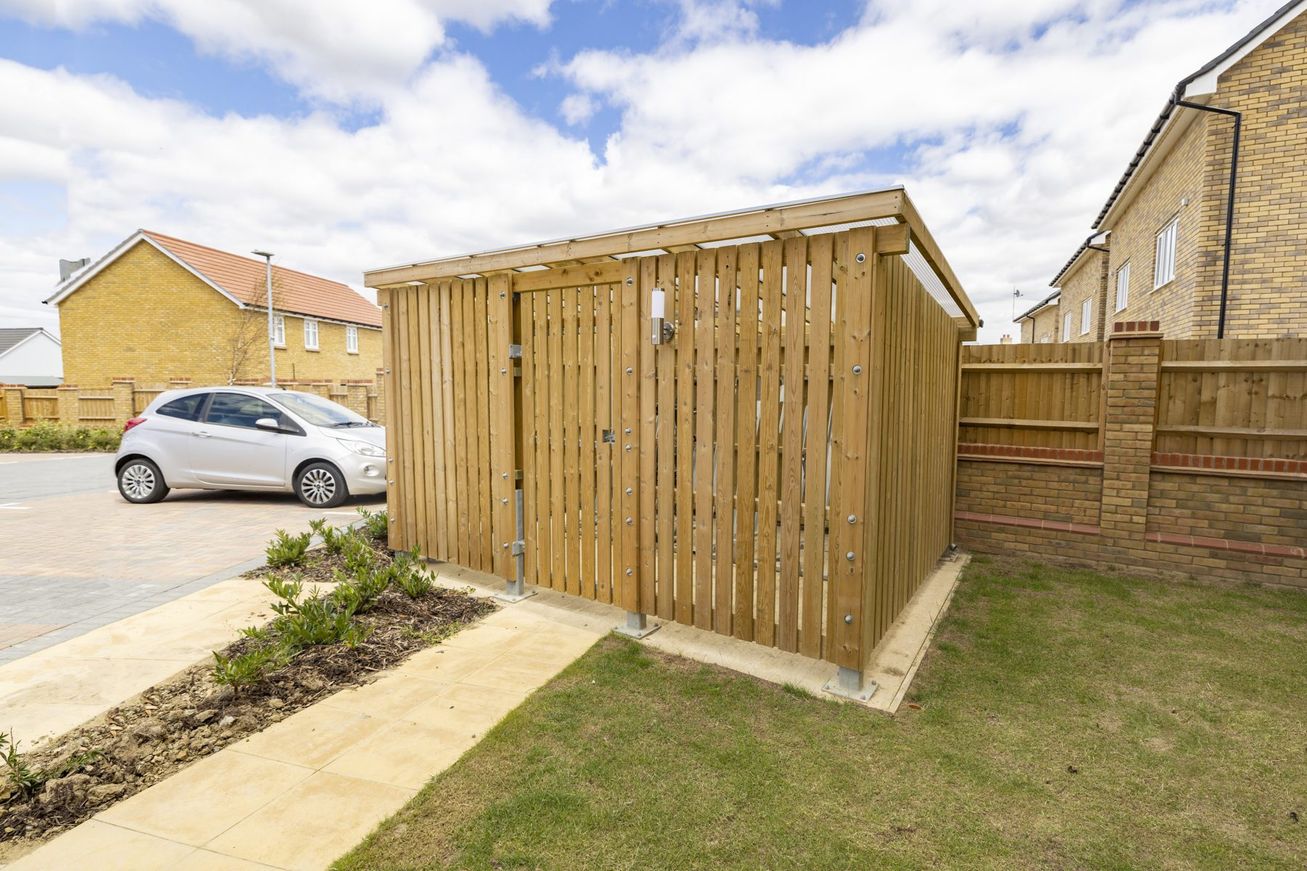 Timber cycle compound with bike racks for new housing development ...