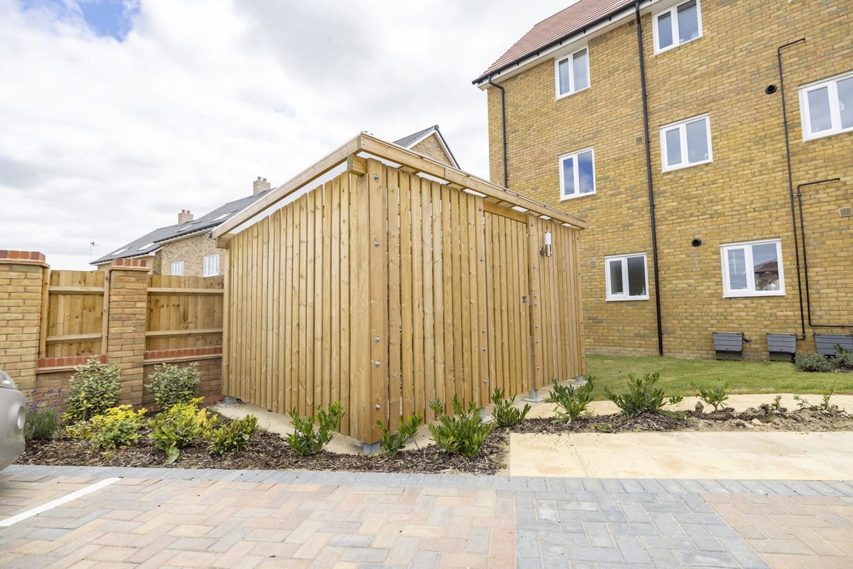 Timber cycle compound with bike racks for new housing development ...