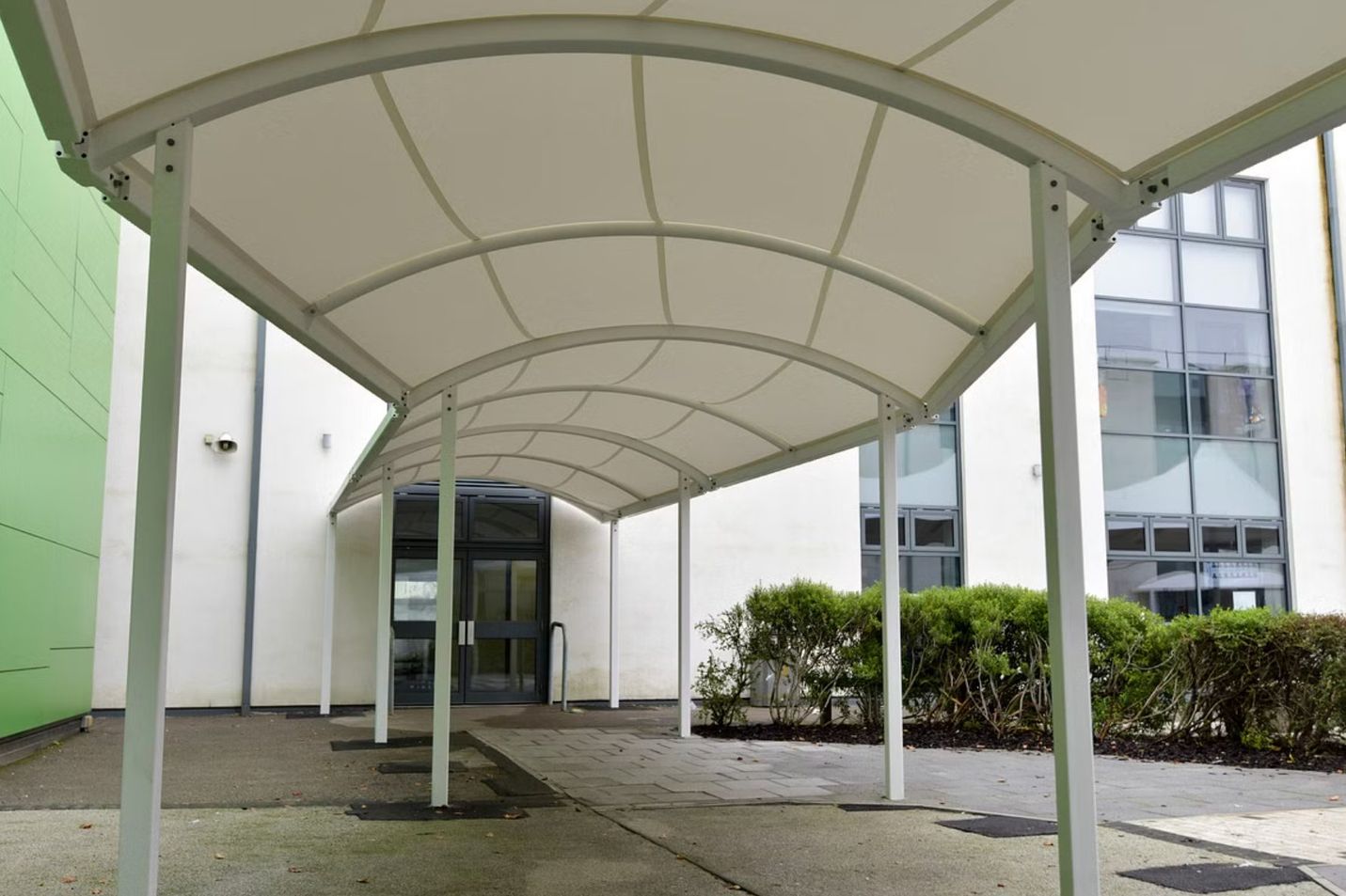 Walkway and conic tensile canopies for community college | Broxap | ESI ...