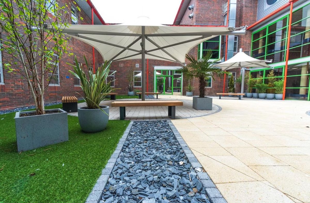 Cantilever-style canopies and benches for hospital courtyards | Broxap ...