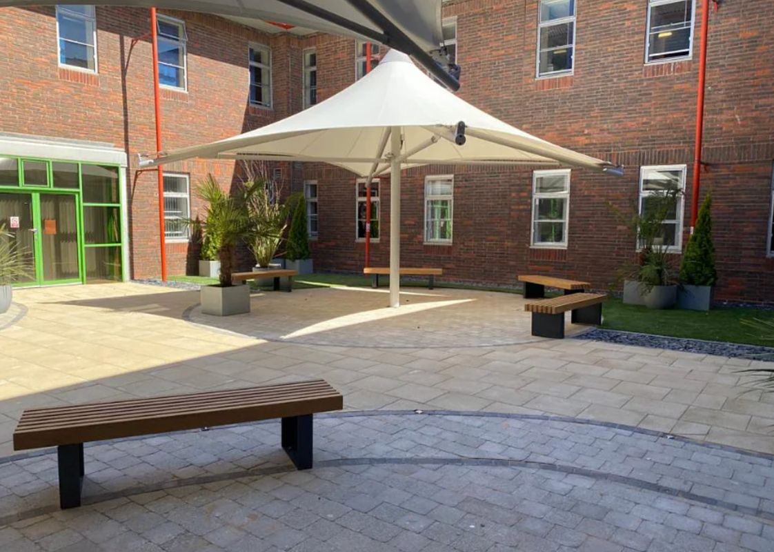Cantilever-style canopies and benches for hospital courtyards | Images