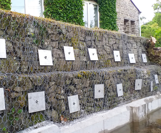 Earth anchors stabilise gabion wall at River Rhiangoll | Platipus ...