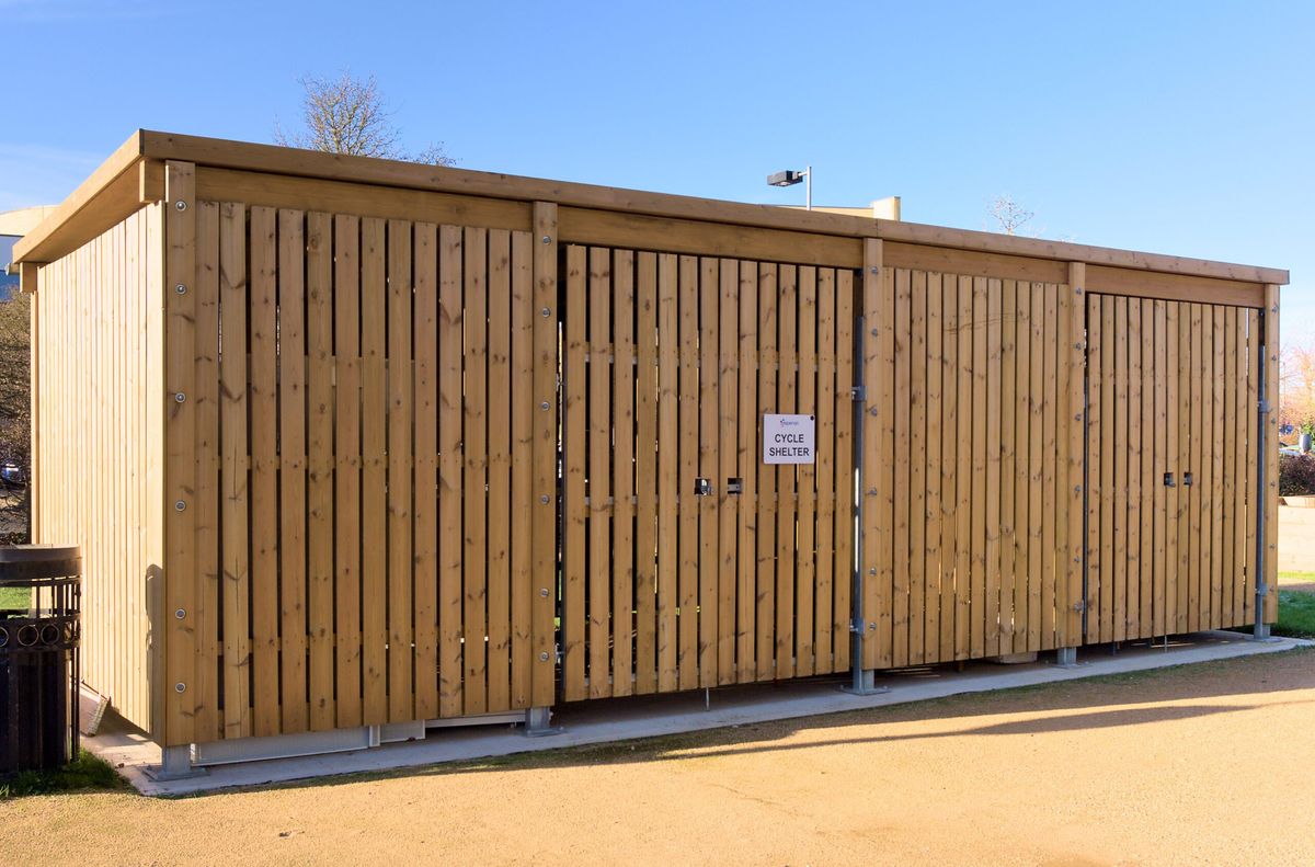 Enclosed cycle shelter with green roof - Sir John Peace Building | Images