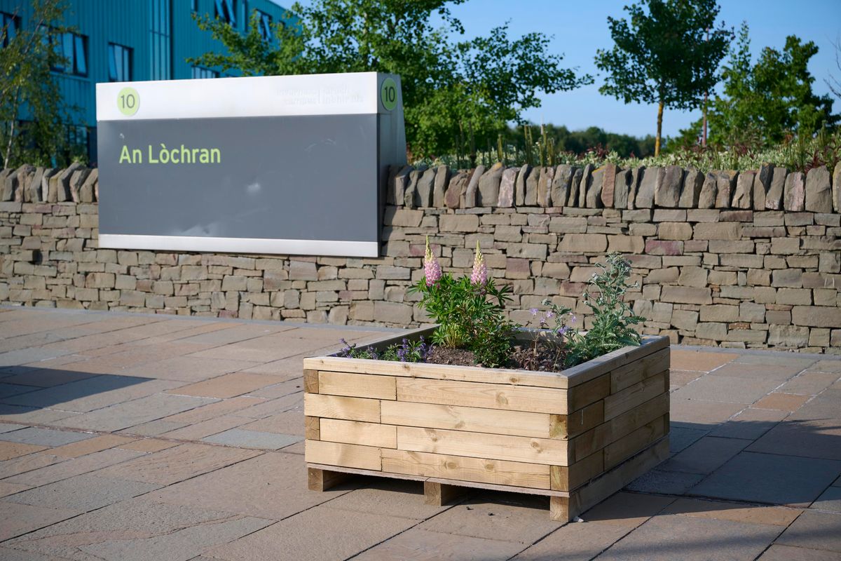 Moveable planters and seating for traffic management at campus | Images
