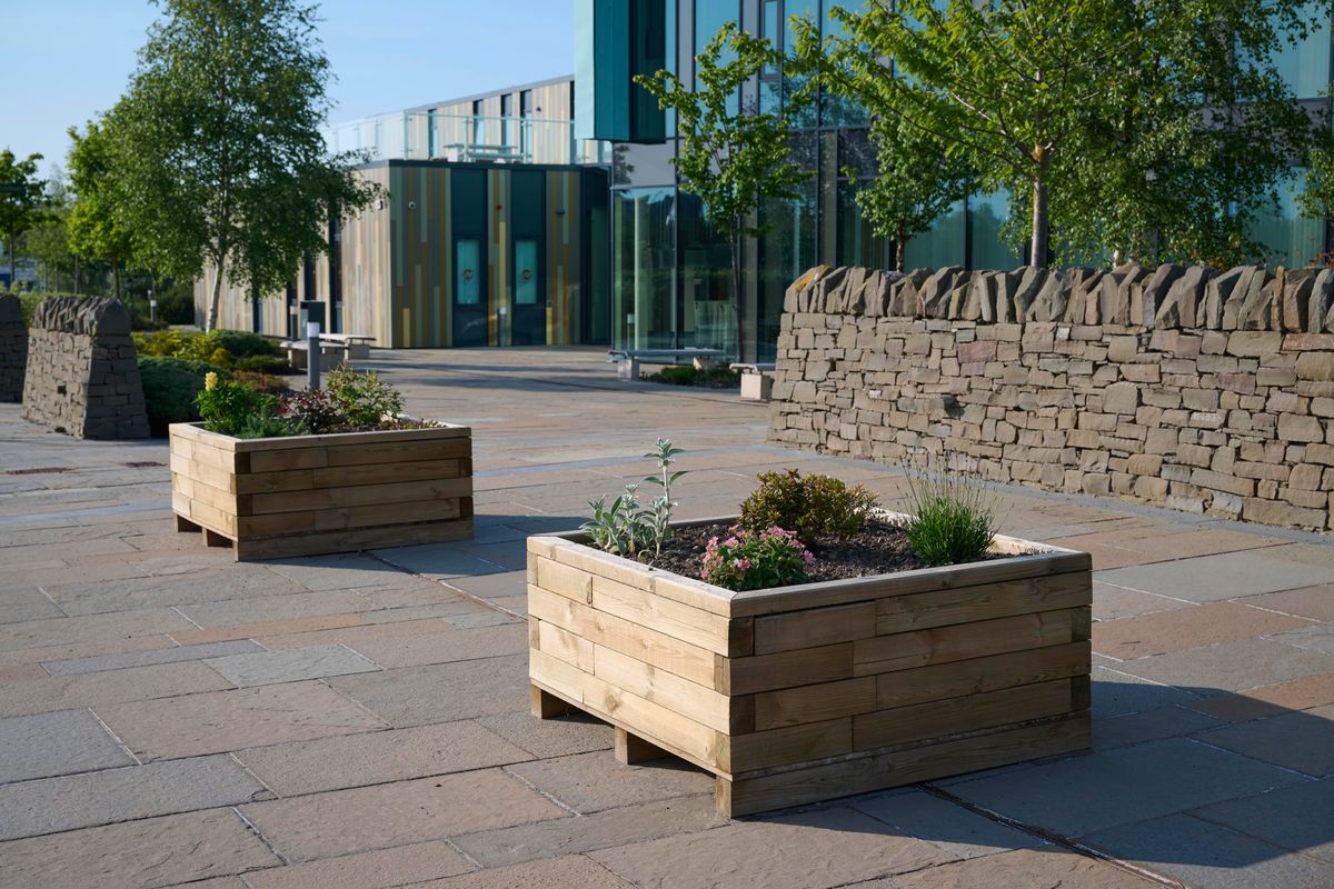 Moveable planters and seating for traffic management at campus | Images