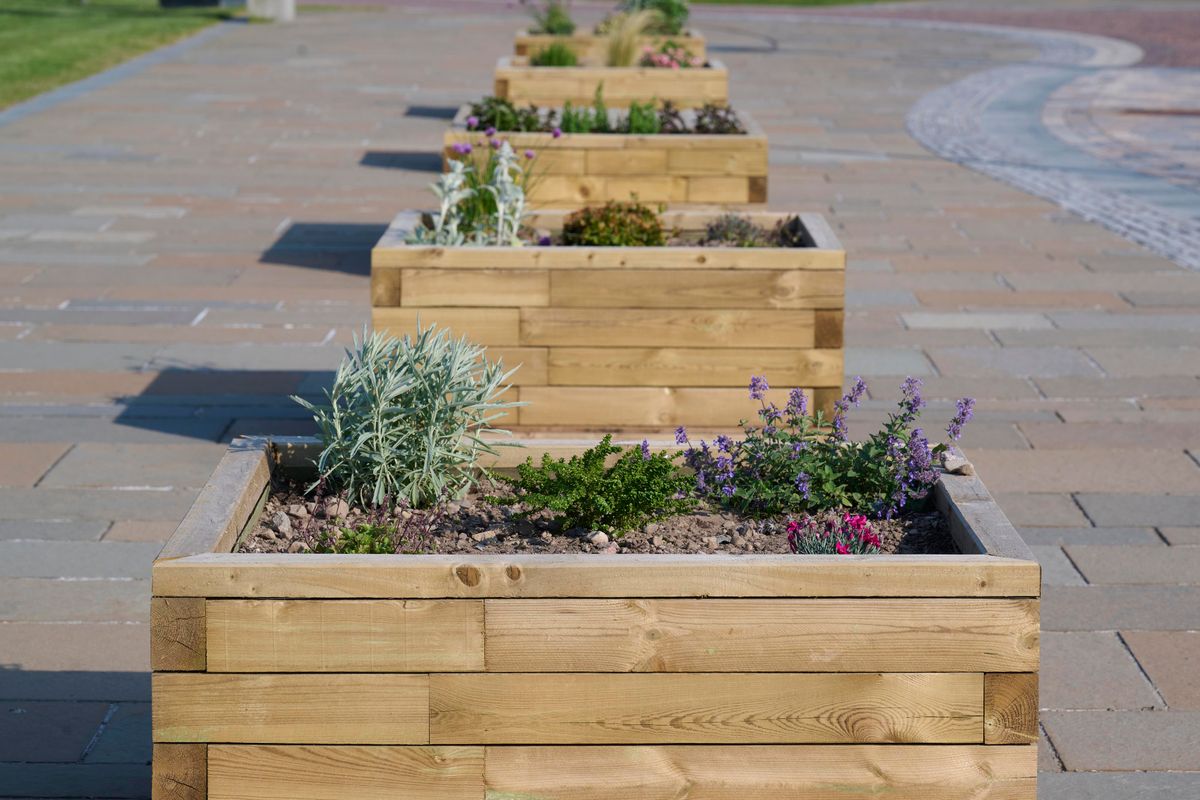 Moveable planters and seating for traffic management at campus | Images