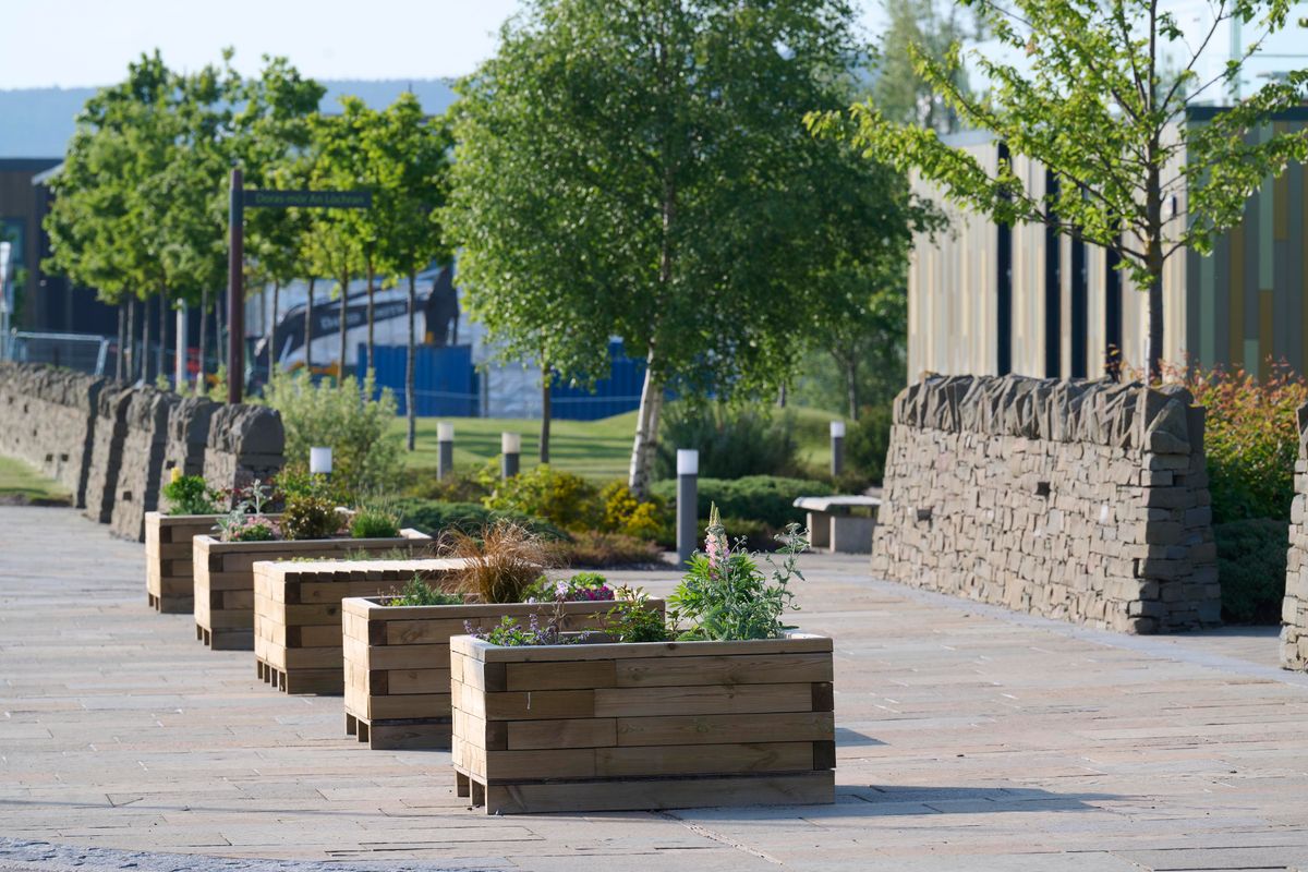 Moveable planters and seating for traffic management at campus | Images
