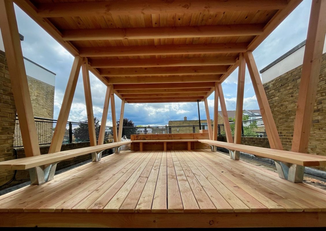 Outdoor classrooms with seating and green roofs for school | Images