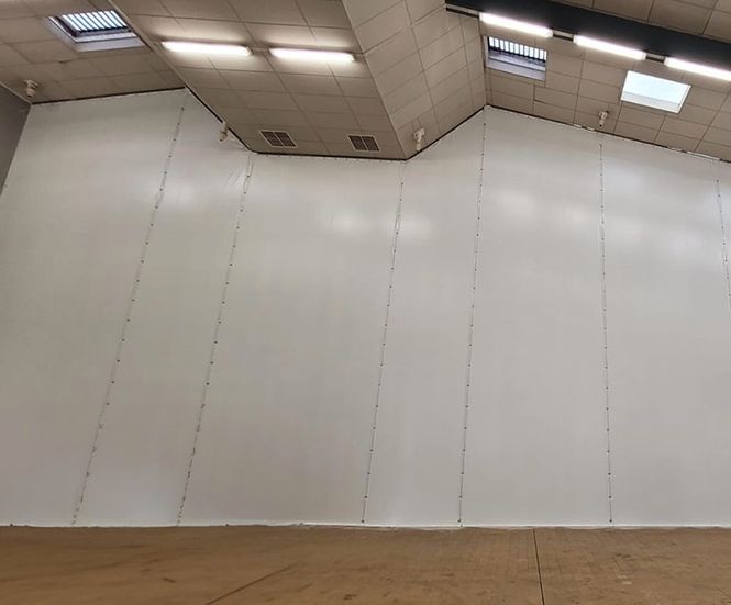 Temporary screen separates ice cream production from groundworks ...
