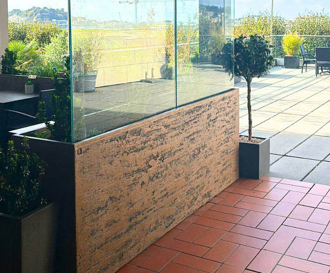 Bespoke UHPC trough planters with integrated glass balustrades | Torc Pots