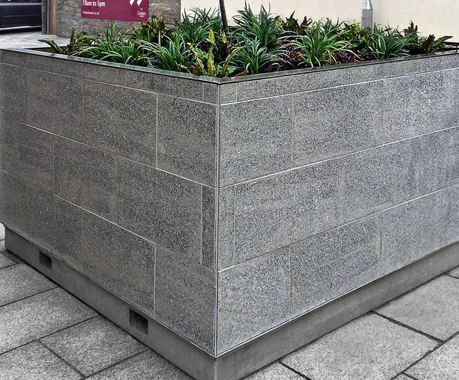 Granite-clad tree planter with forklift slots | Factory Furniture