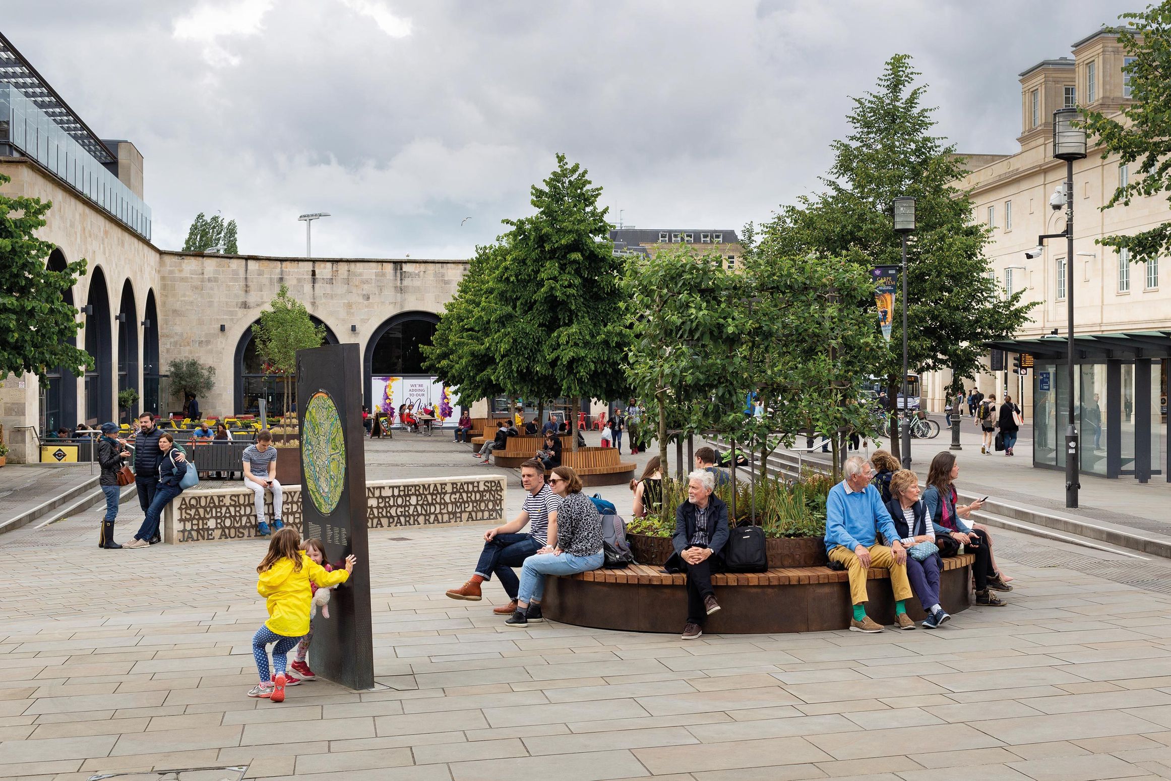Movable circular hardwood tree seats for public realm | Woodscape | ESI ...