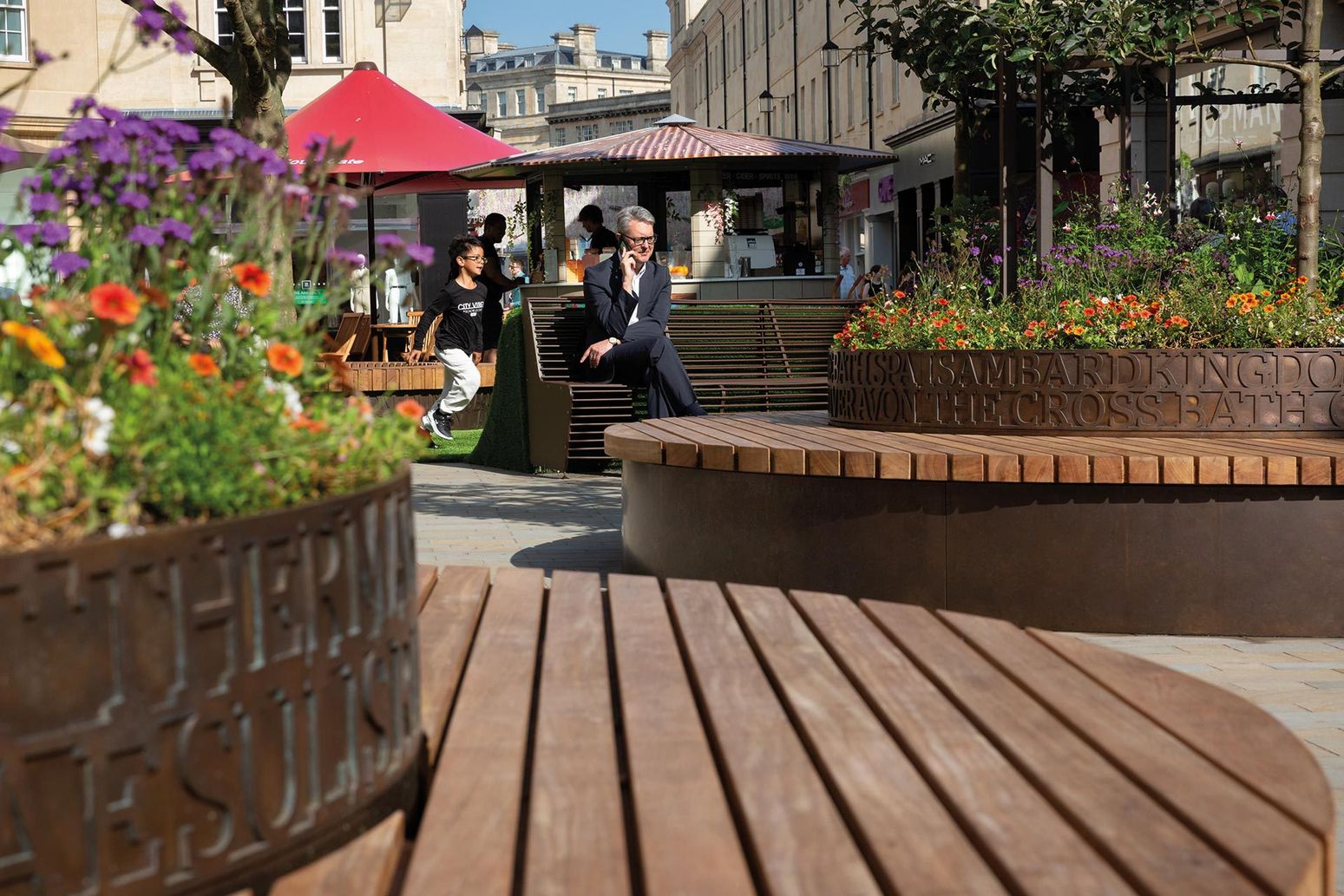 Movable circular hardwood tree seats for public realm | Woodscape | ESI ...