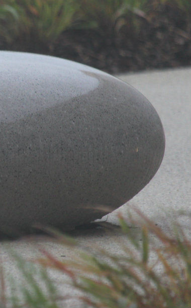 Polished concrete pebble seats for office landscaping | Images