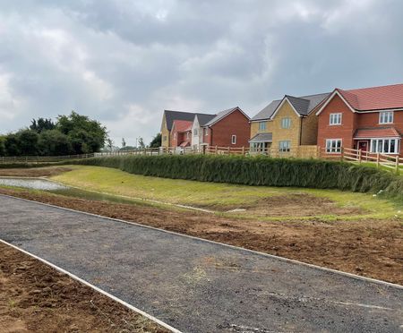 Earth reinforced retaining walls for attenuation ponds | GeoGrow | ESI ...