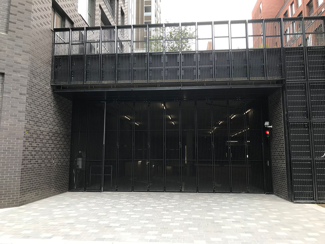 Electrically-operated multi-fold gates for service bay | Images